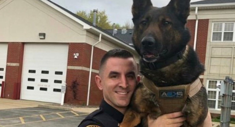 HE HELD HIS K9 PARTNER WITH A SMILE—BUT THE STORY BEHIND THIS PHOTO ...